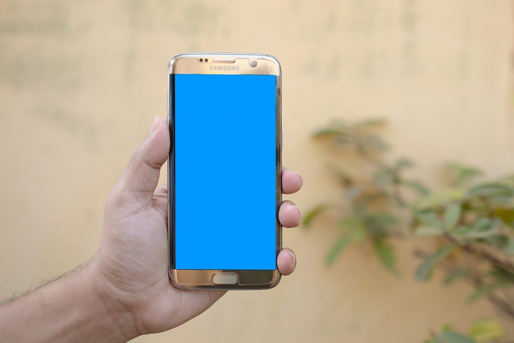 A Samsung smartphone in hand - PixaHive