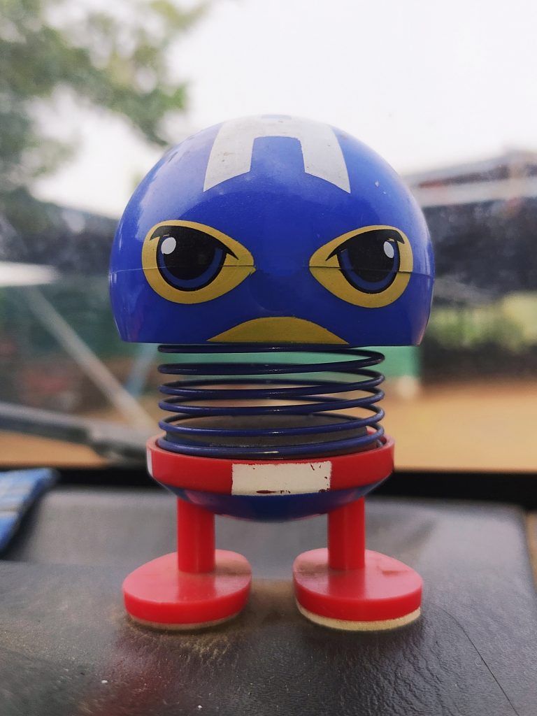 A spring toy on car dashboard - PixaHive