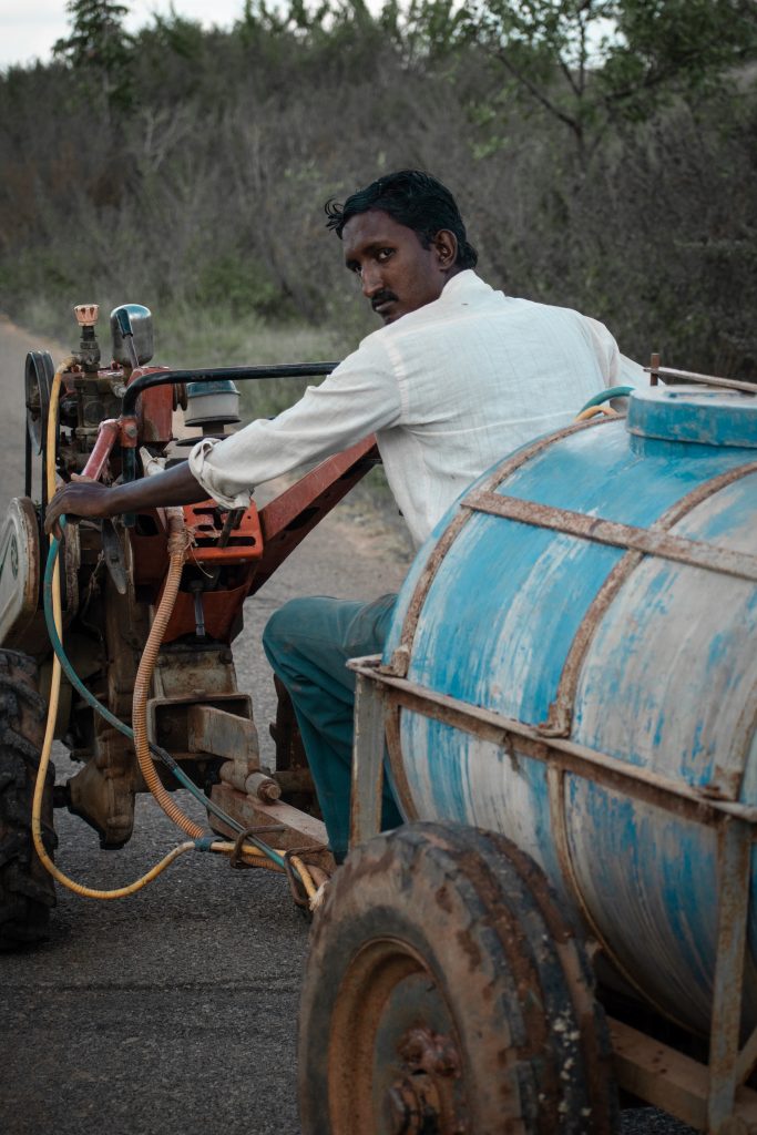 A man carrying water tank - PixaHive
