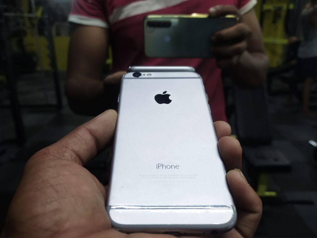 An iPhone in hand - PixaHive