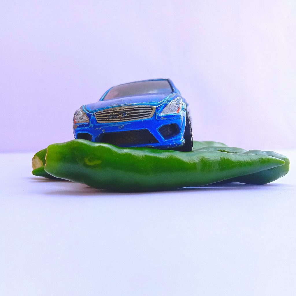 A toy car on green chilli - PixaHive