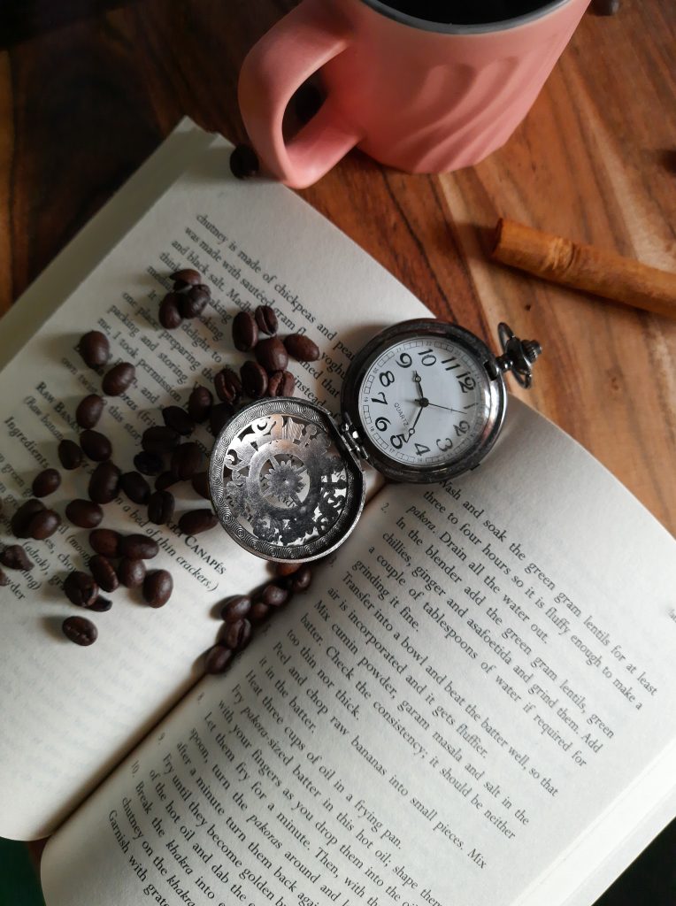 An antique watch and book - PixaHive