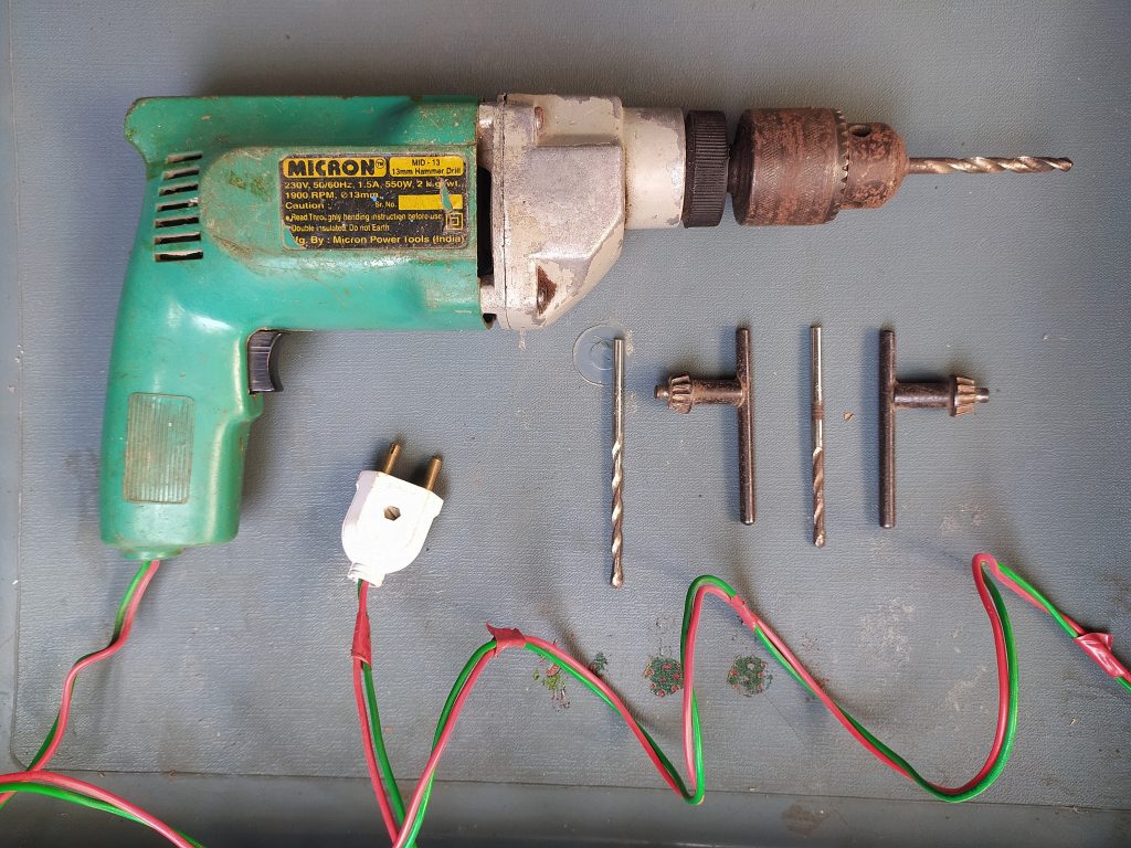 An electric drill machine and bits - PixaHive