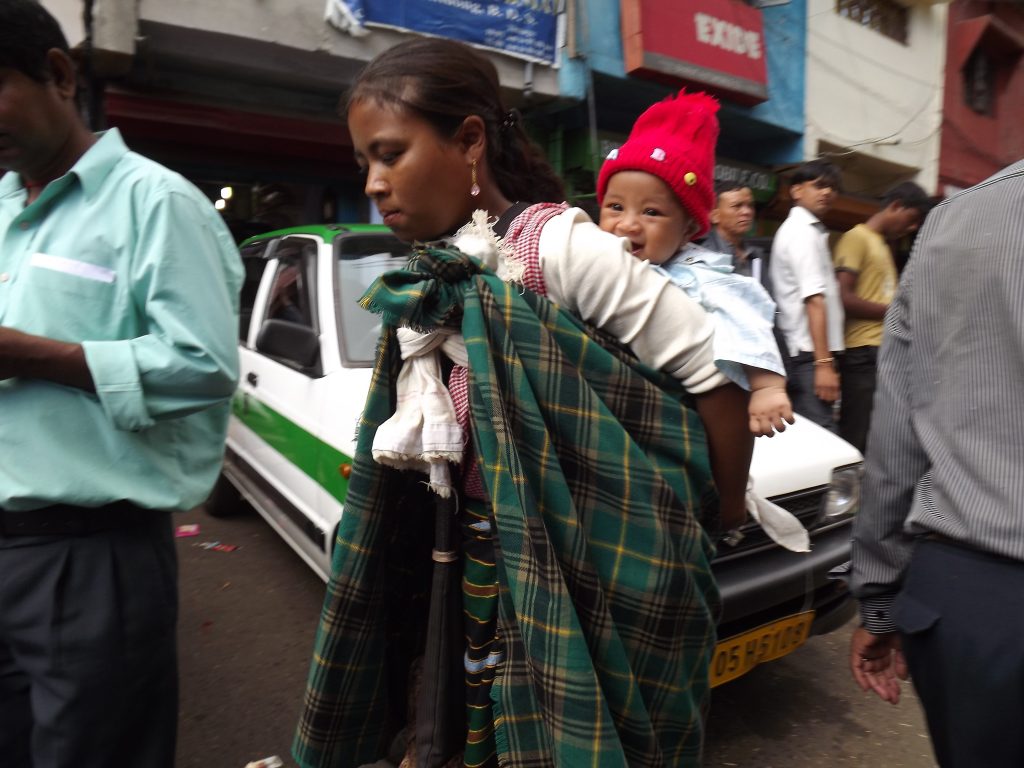 A woman carrying baby on back - PixaHive