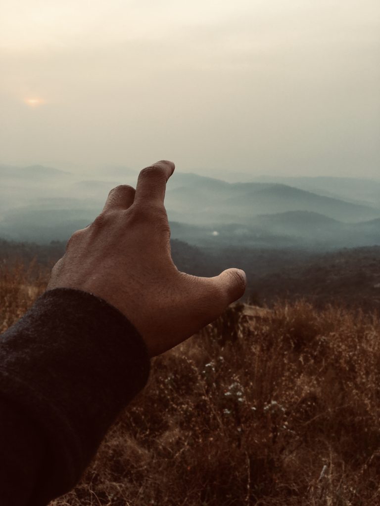 Hand towards mountains - PixaHive