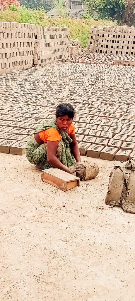 A lady making bricks - PixaHive