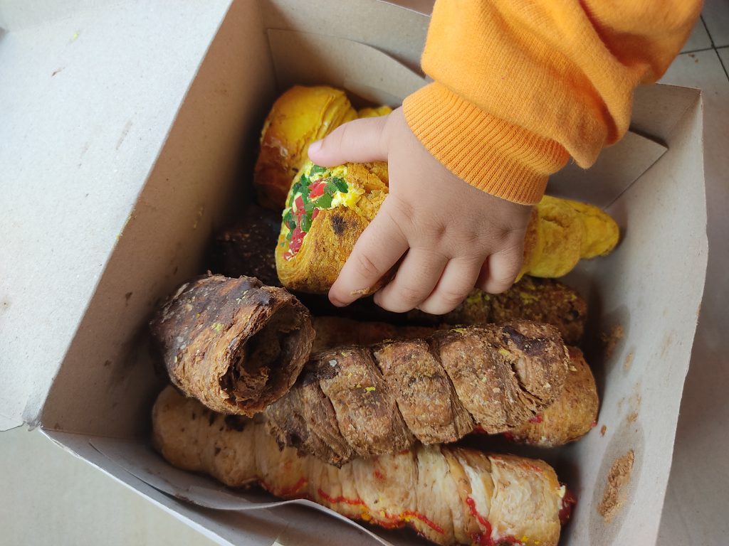 Little boy picking bakery roll - PixaHive