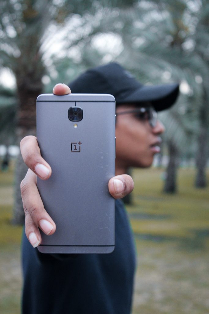 A boy showing his mobile phone - PixaHive