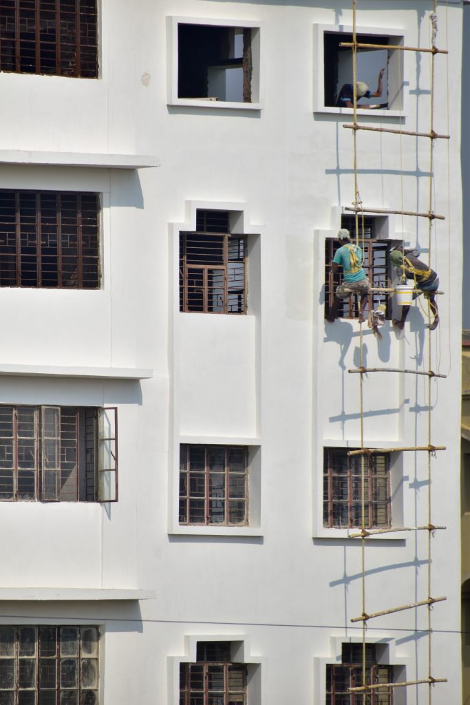 Painter Painting a Building - PixaHive
