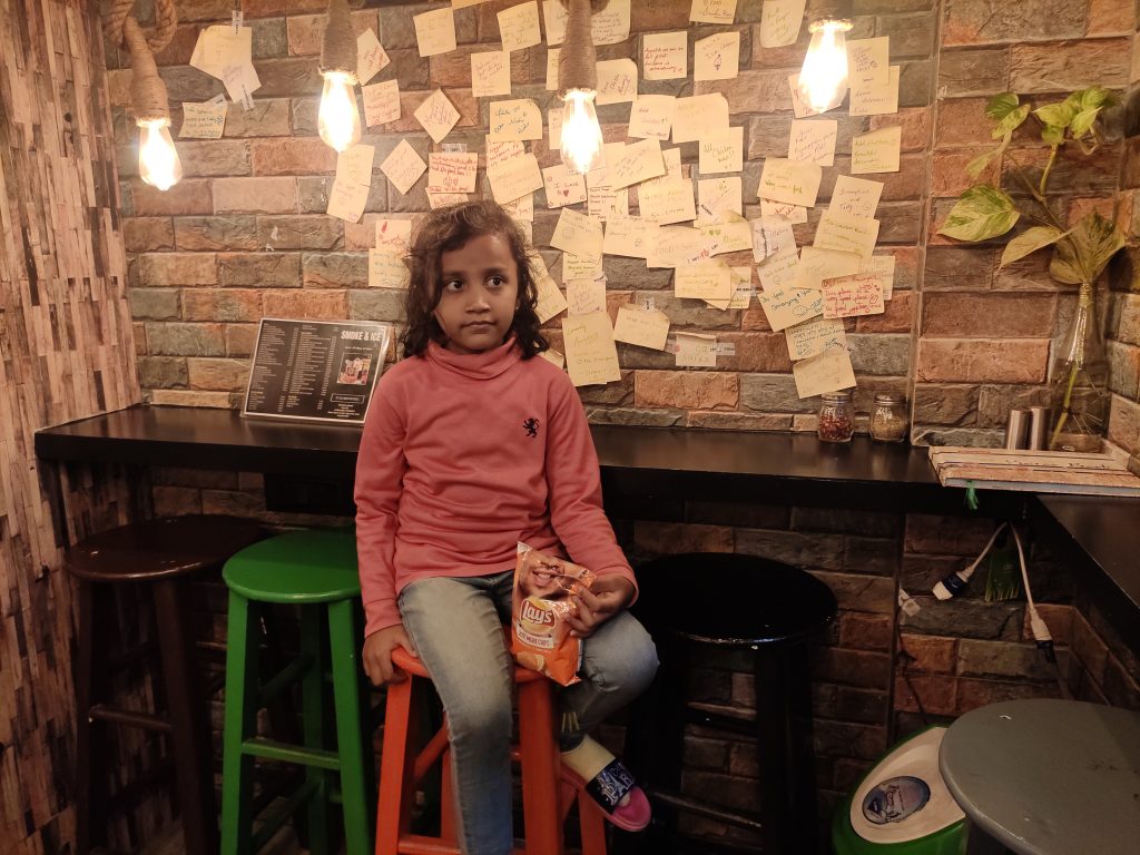 Portrait of girl sitting on table - PixaHive
