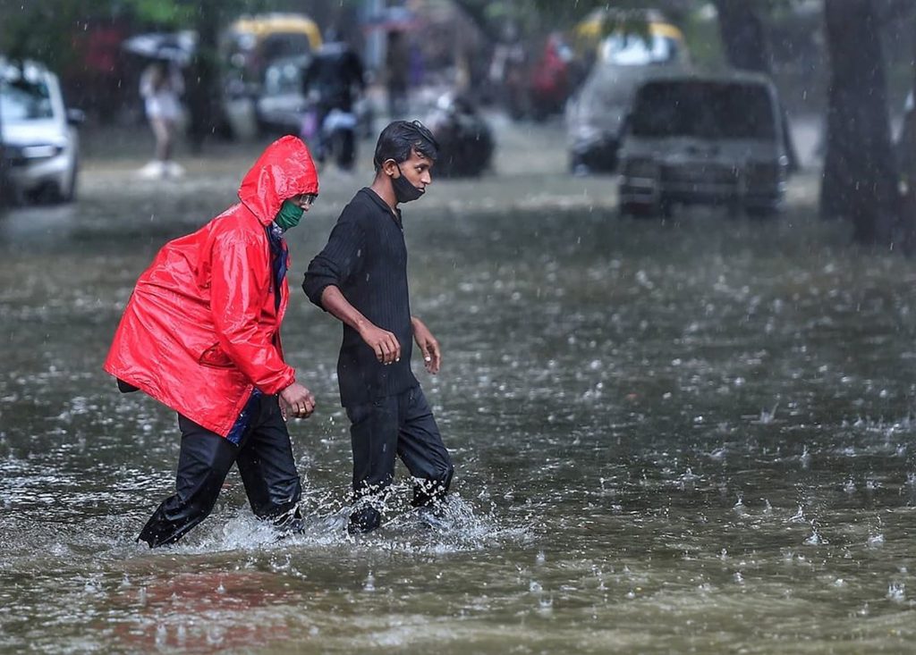 Student going school during heavy rains - PixaHive