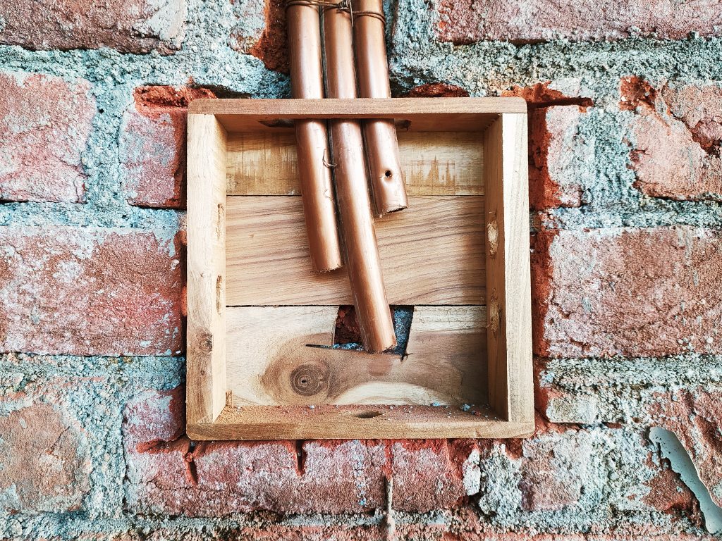 A wooden electric frame fixed on wall - PixaHive