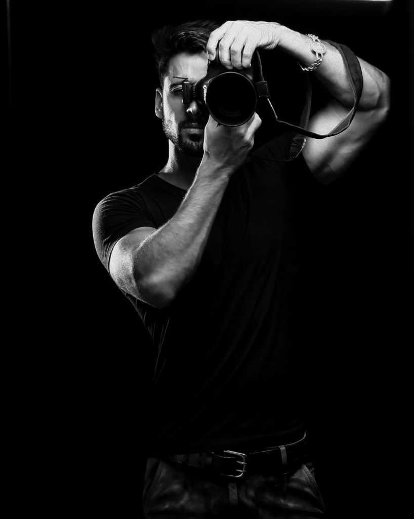 man posing with camera - PixaHive