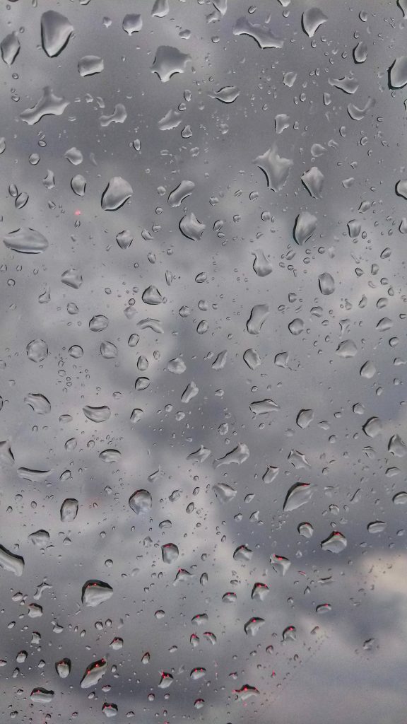 rain drops on car window and red light on drops - PixaHive