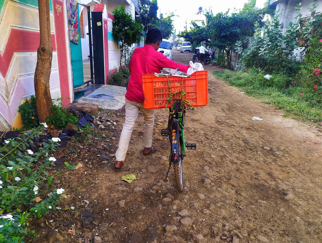 A boy carrying things on bicycle - PixaHive