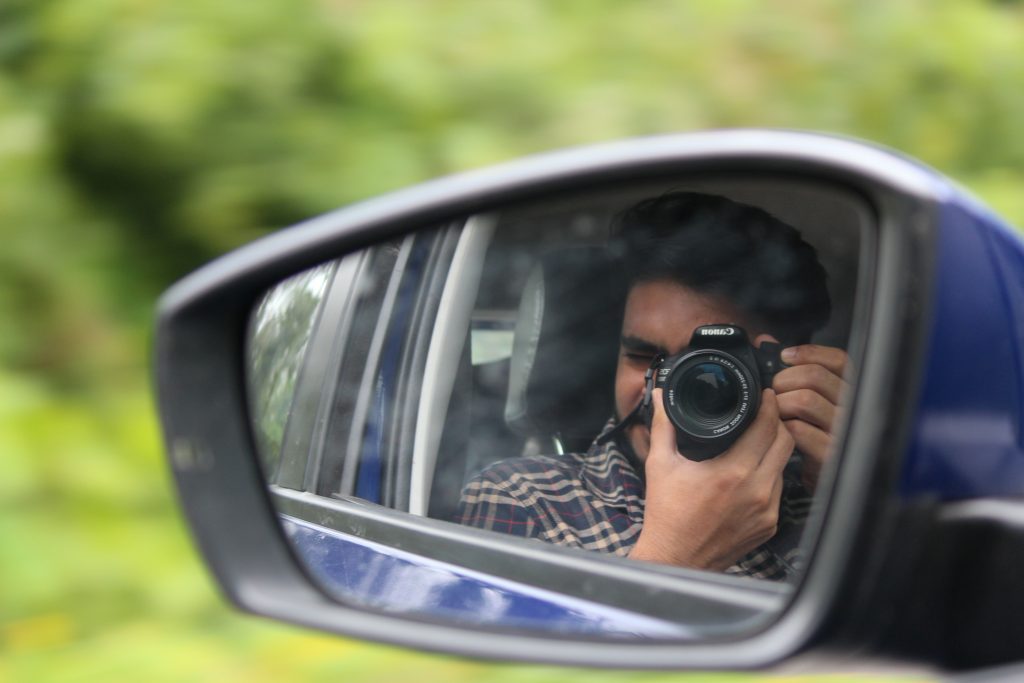A photographer capturing through back mirror - PixaHive