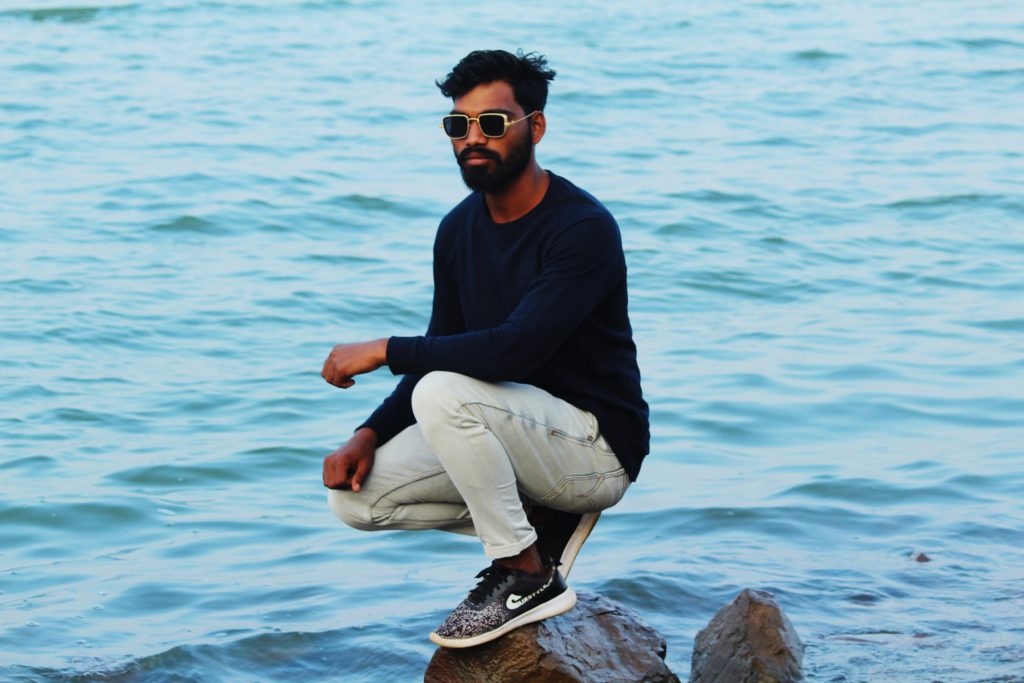 A stylish boy on a beach - PixaHive