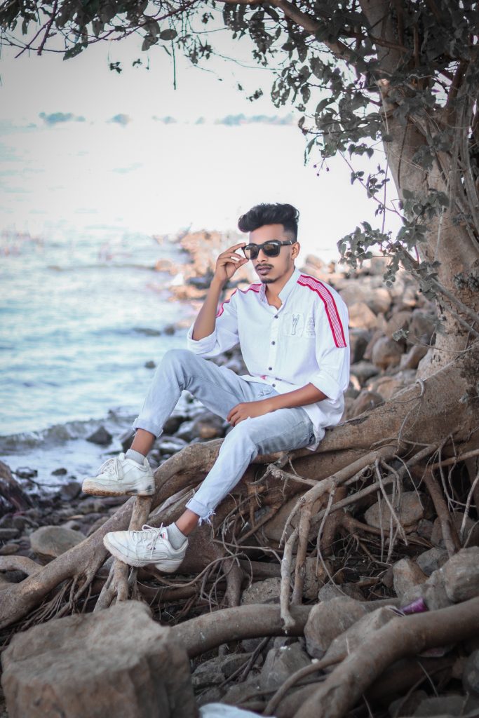 A stylish boy on a tree roots - PixaHive