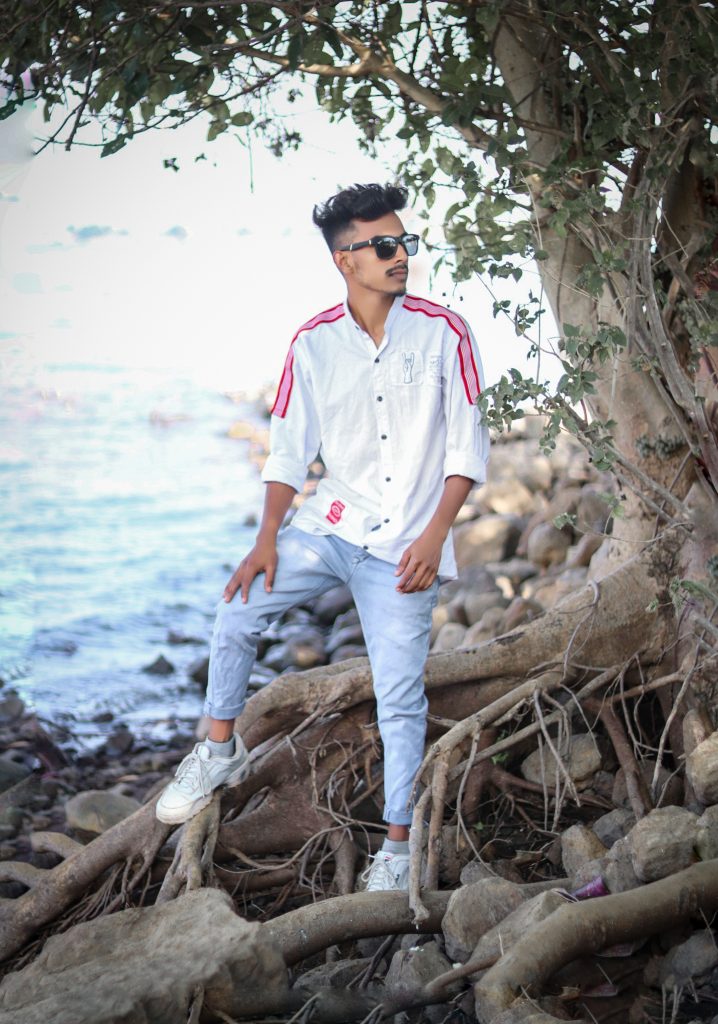 A stylish boy on a tree roots - PixaHive