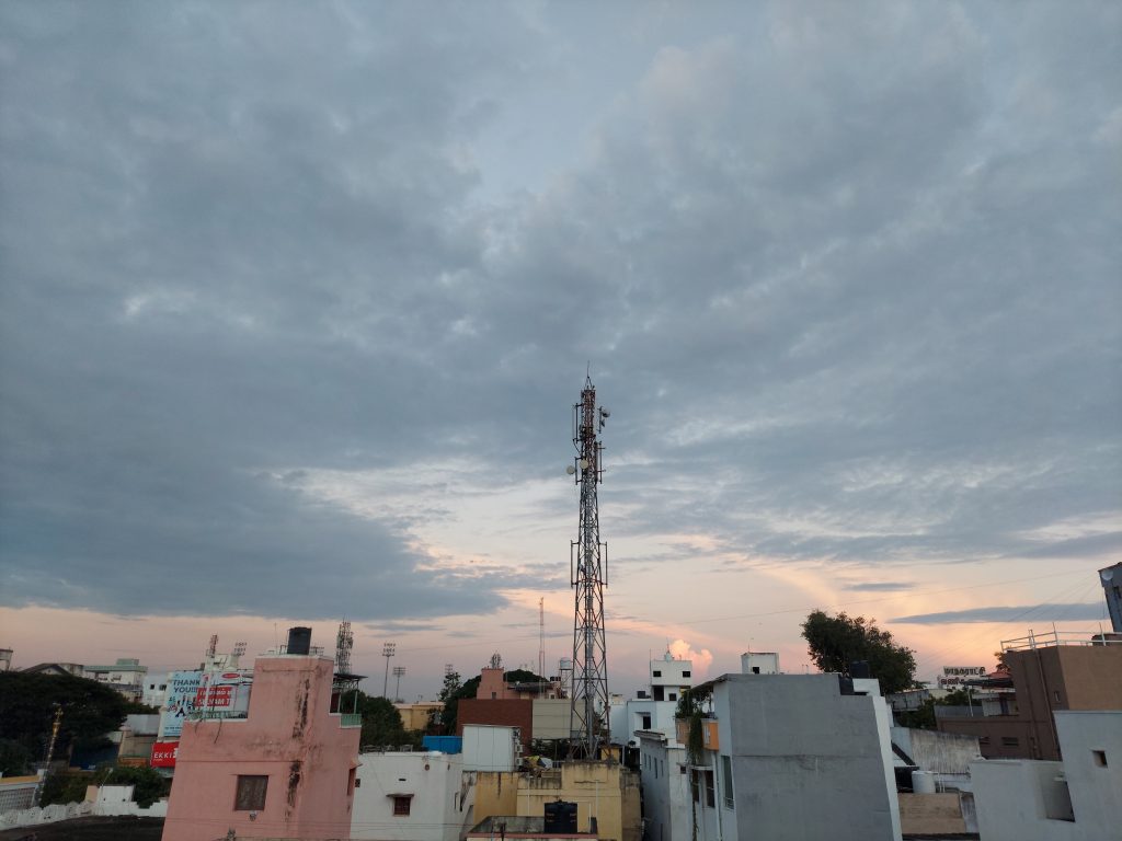 A telecom tower on city buildings - PixaHive