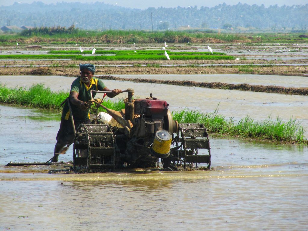 A farmer with a machine in his field - PixaHive