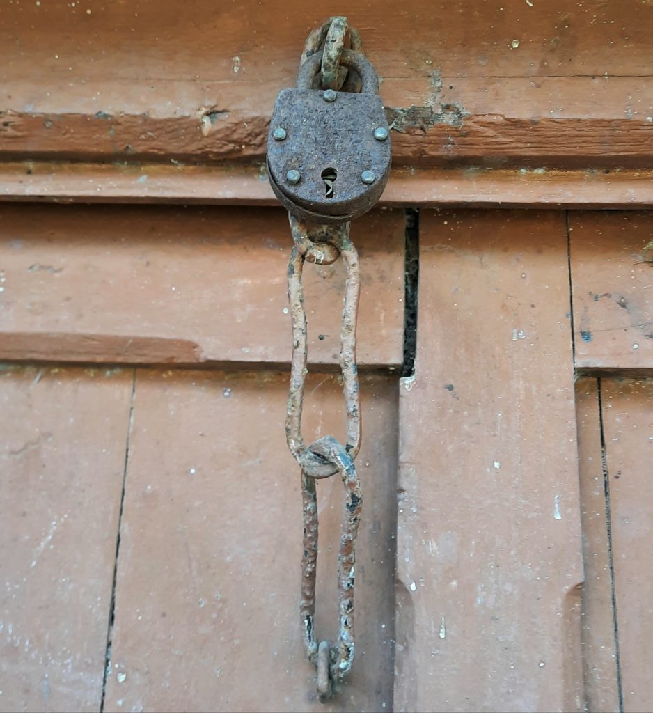 Old lock hanging on iron chain - PixaHive