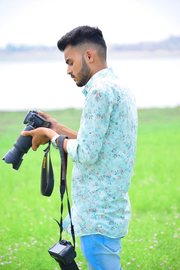 boy holding a camera - PixaHive