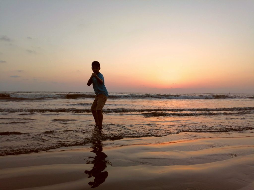 Boy on beach during sunset - PixaHive