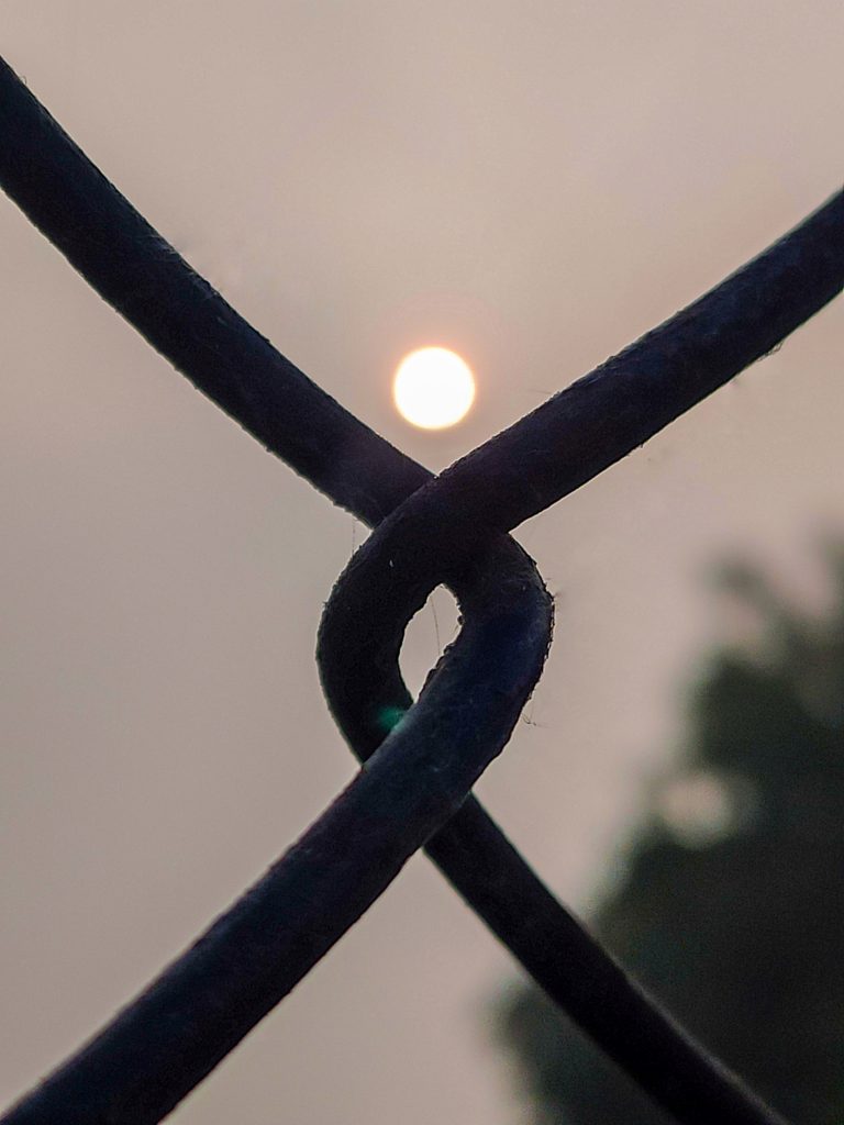 Sunset through locked wires - PixaHive