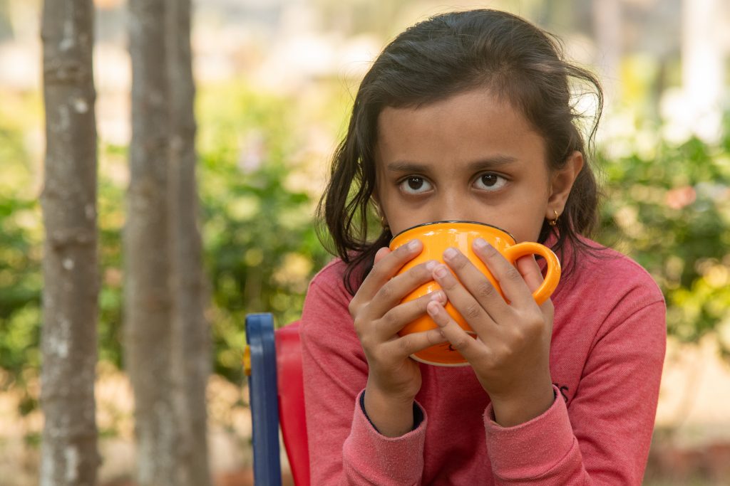 A girl taking tea - PixaHive