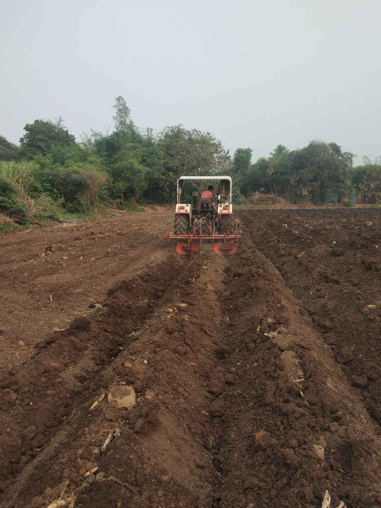 A tractor ploughing a field - PixaHive