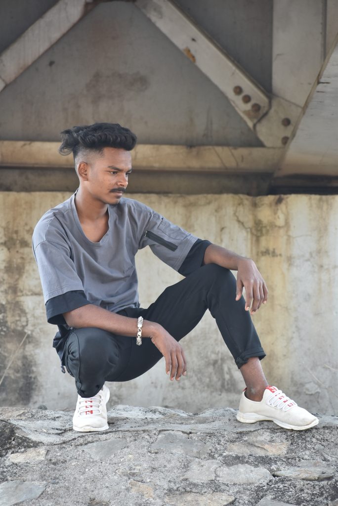 Boy posing while sitting - PixaHive