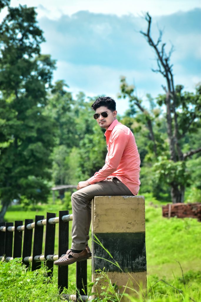 Boy posing while sitting - PixaHive