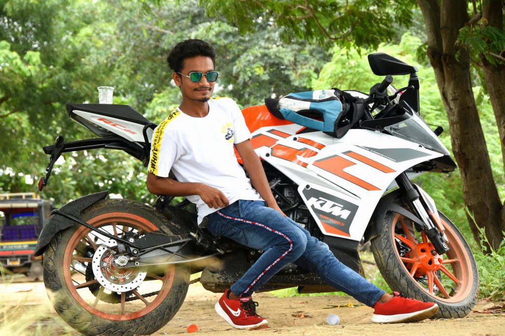 Boy posing with KTM bike - PixaHive