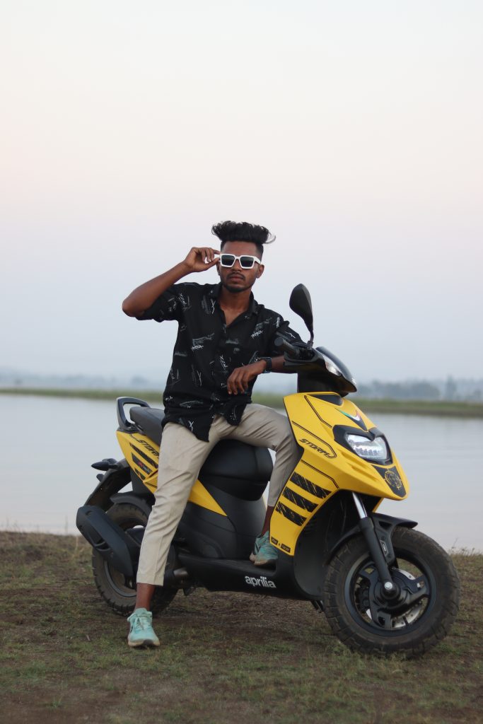 Boy posing on scotty near river - PixaHive