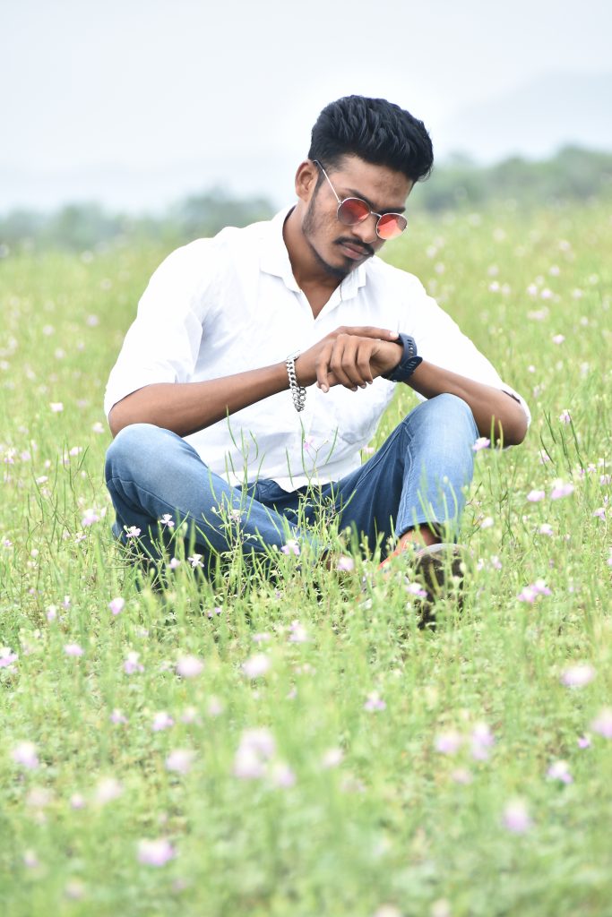 A boy checking in his wristwatch - PixaHive