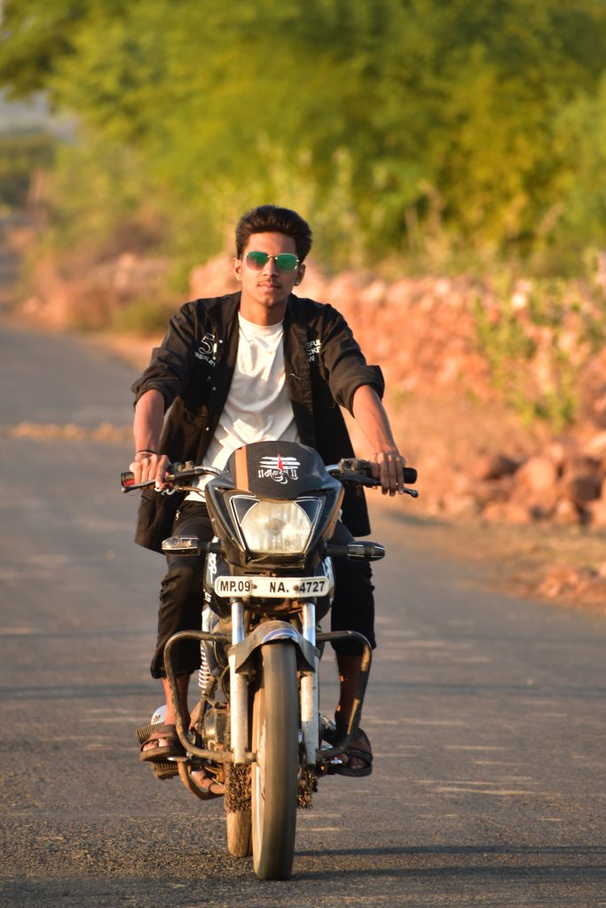 A boy driving a motorcycle - PixaHive