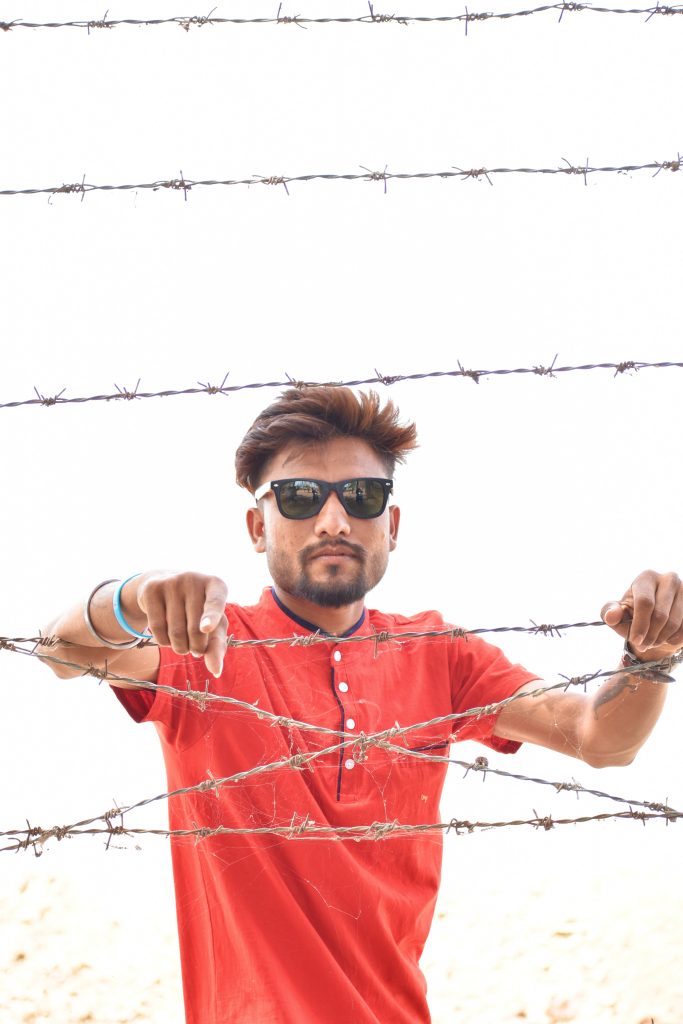 A boy near wire fencing - PixaHive