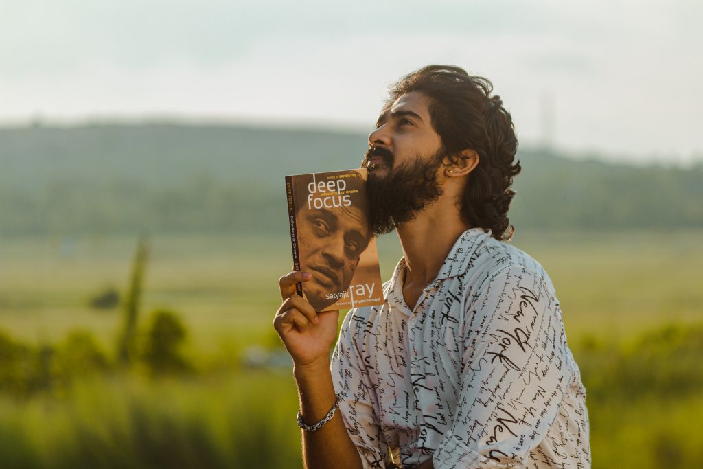 A man thinking while reading a book - PixaHive
