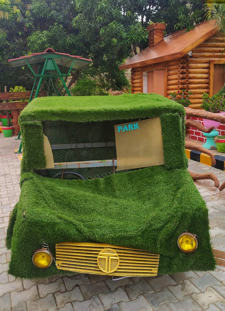 A showpiece car in a garden - PixaHive