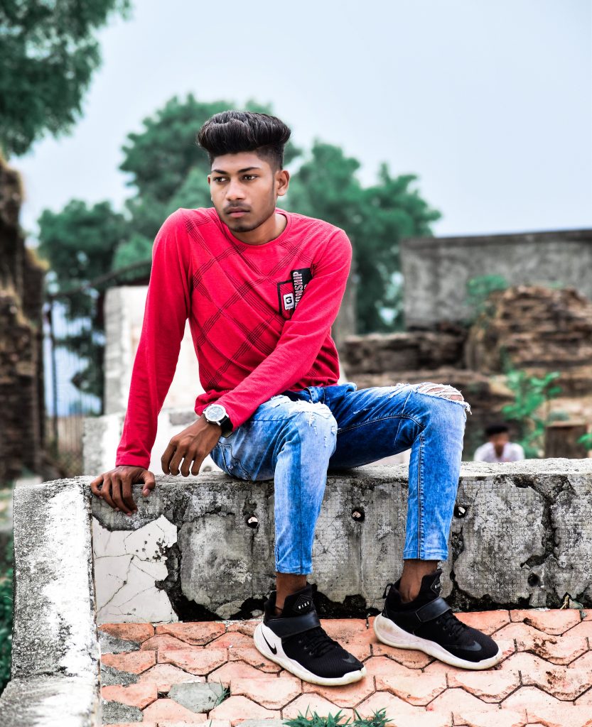 Boy posing while sitting - PixaHive
