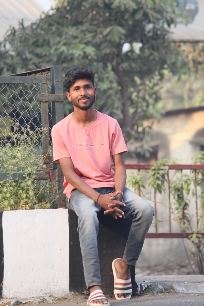 Boy posing while sitting - PixaHive