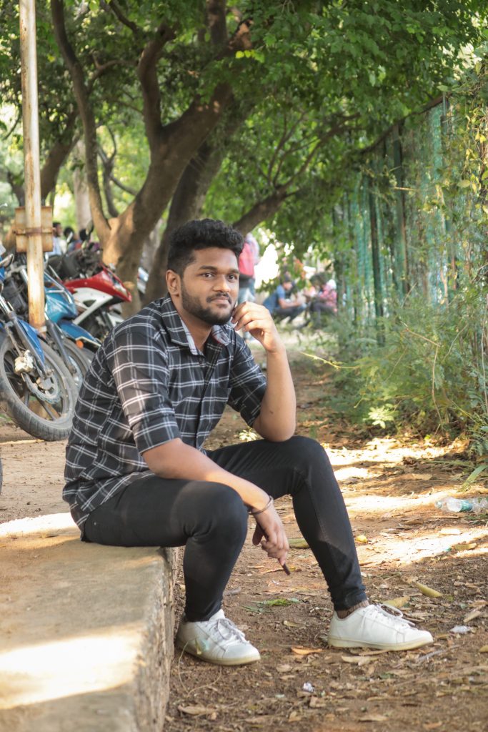 Boy sitting and posing - PixaHive