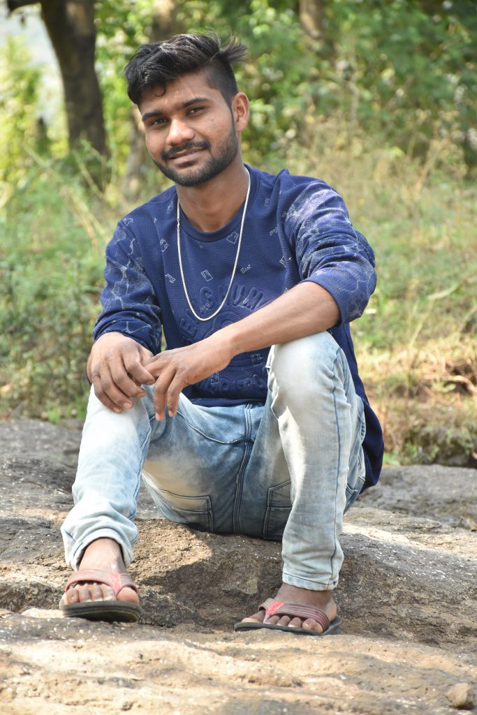 Boy sitting and posing in the forest - PixaHive