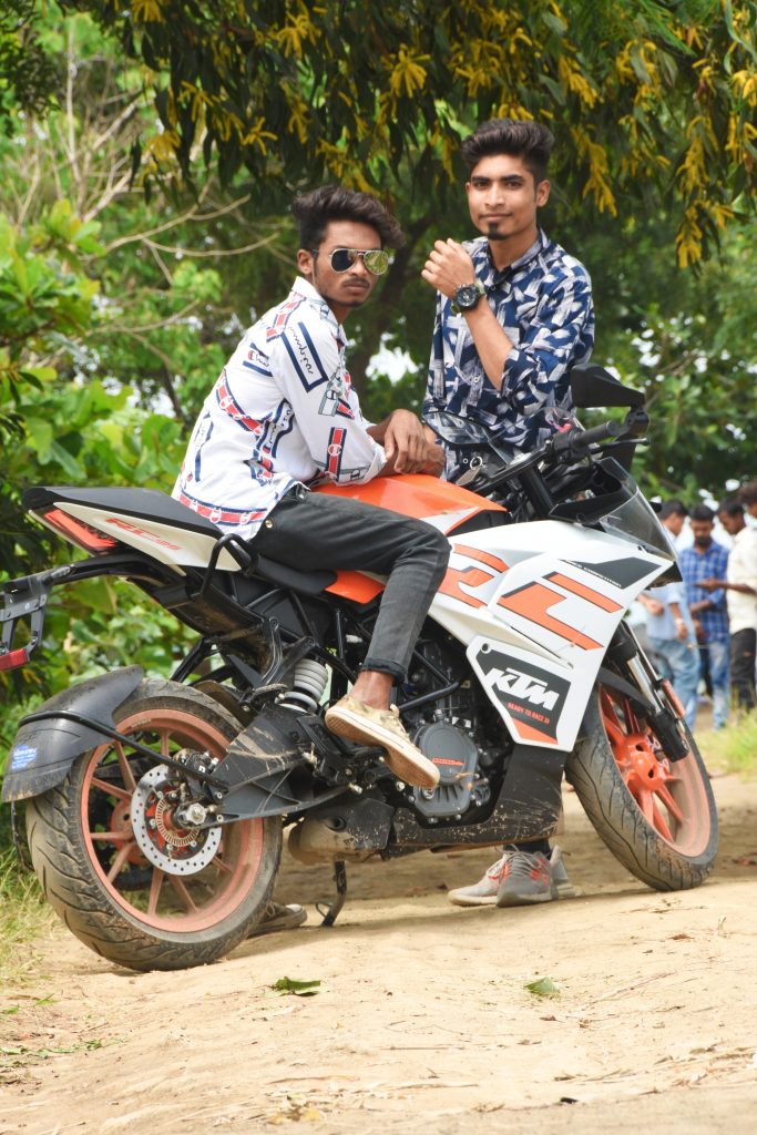 Boys posing on KTM bike - PixaHive
