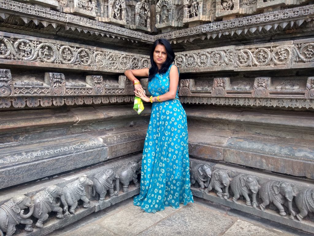 Girl posing against the temple wall - PixaHive