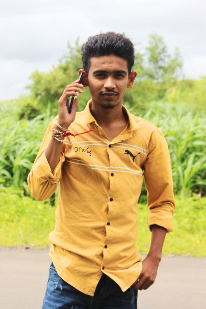 Boy posing with phone - PixaHive