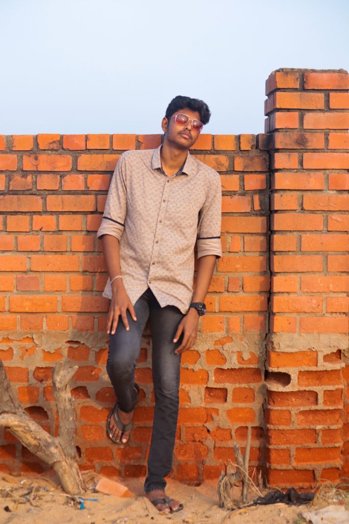 Man Standing against the wall - PixaHive