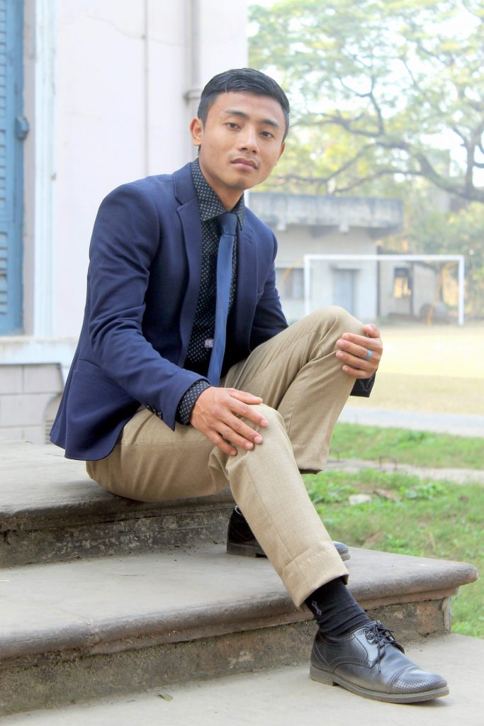 Man posing while sitting on stairs - PixaHive