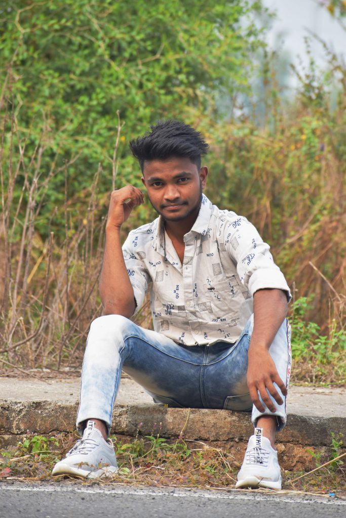 Boy posing while sitting in the farm - PixaHive